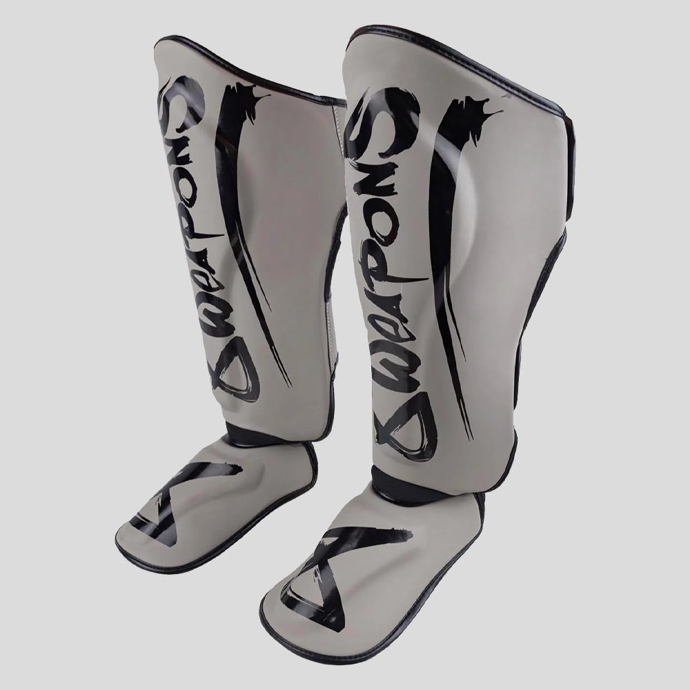8 Weapons Unlimited 2.0 Shin Guards Sand/Black from Made4Fighters