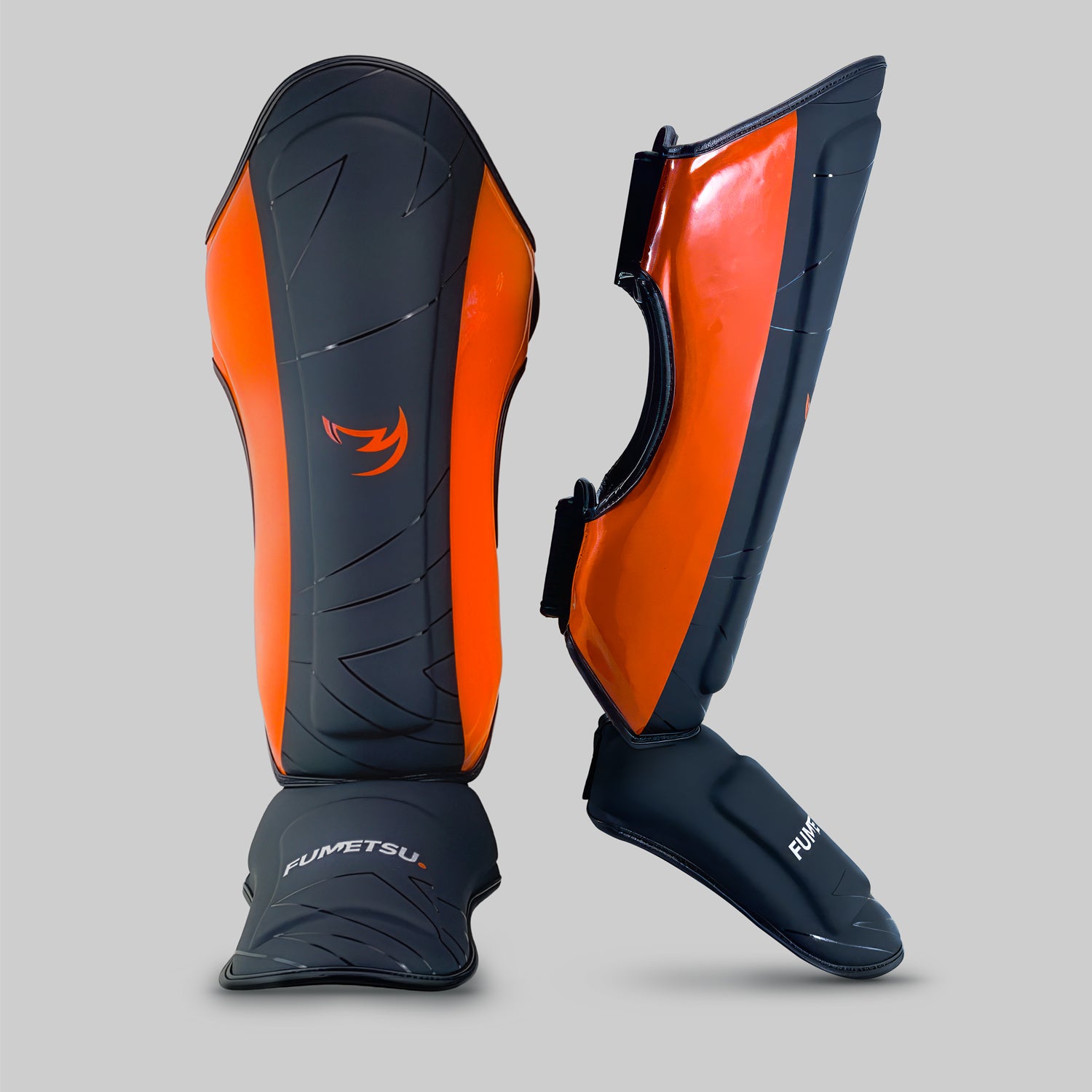 Fumetsu Icon Thai Shin Guards Black/Orange from Made4Fighters